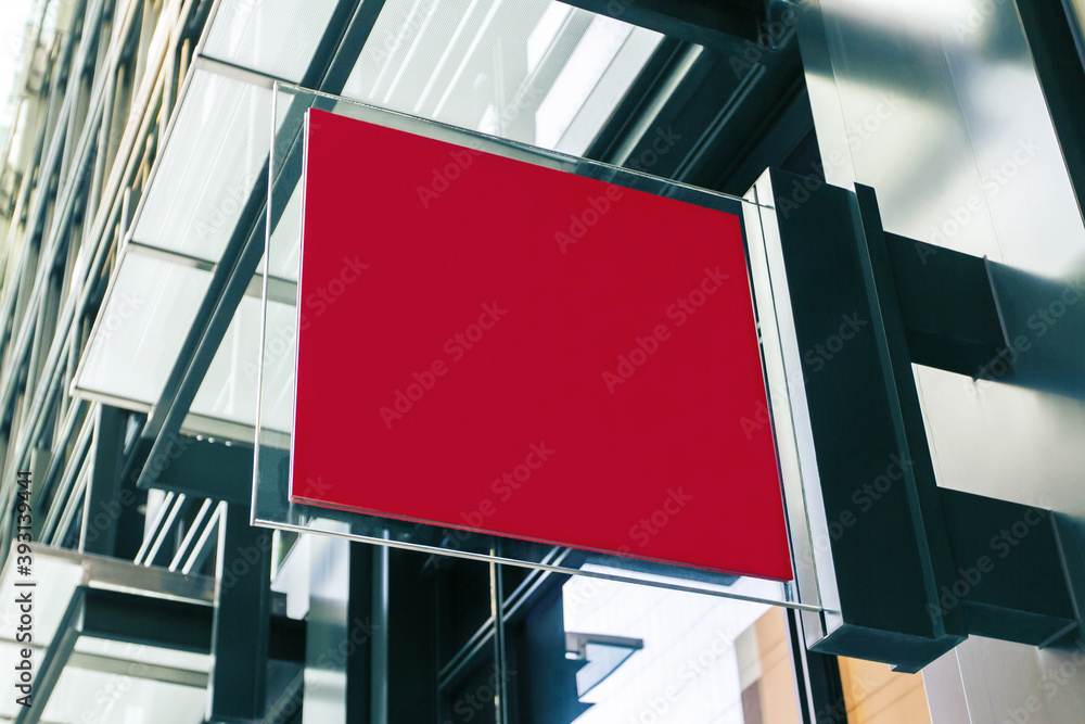 Red square sign with blank space for your logo on the wall of a modern ...