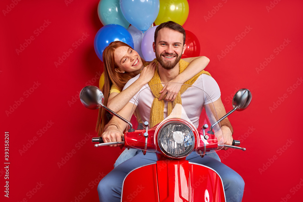 nice beautiful couple on motorcycle bringing carrying bunch air balls ...