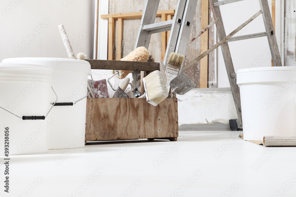 Indoor shot close up frontal view of bricklayer or house painter tools ...