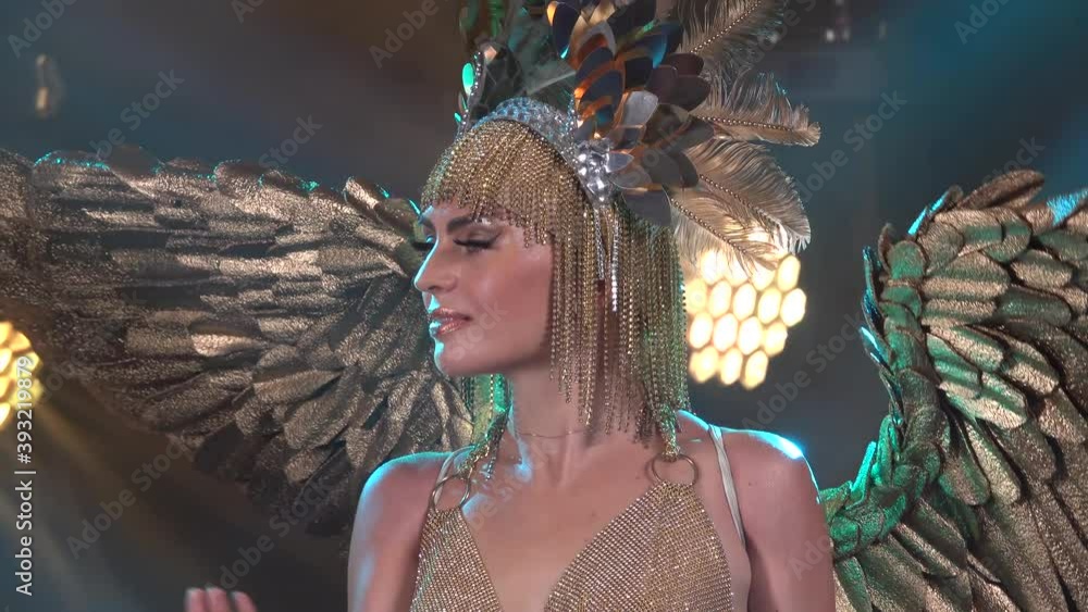 Gorgeous female actress dressed as the Greek goddess Artemis with wings ...