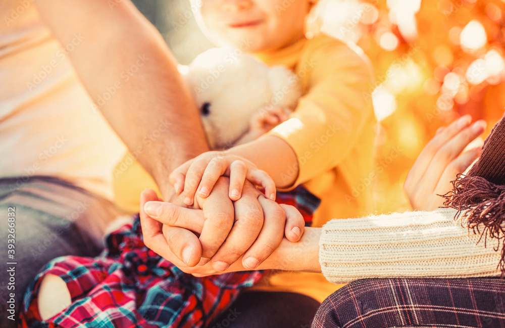 Hands of father, mother, keep hand little baby. Parents hold the baby ...