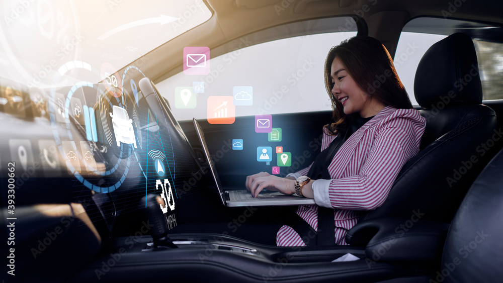 Auto pilot self driving car businesswoman working using computer laptop ...