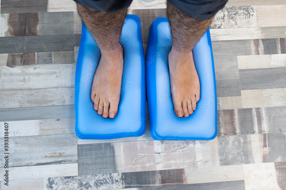 Man's feet on a pressure platform to make orthotics for the shoes Stock ...