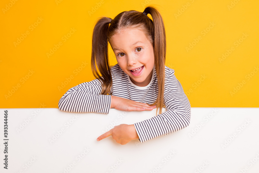 Portrait of young smiling cheerful little girl child kid pointing ...