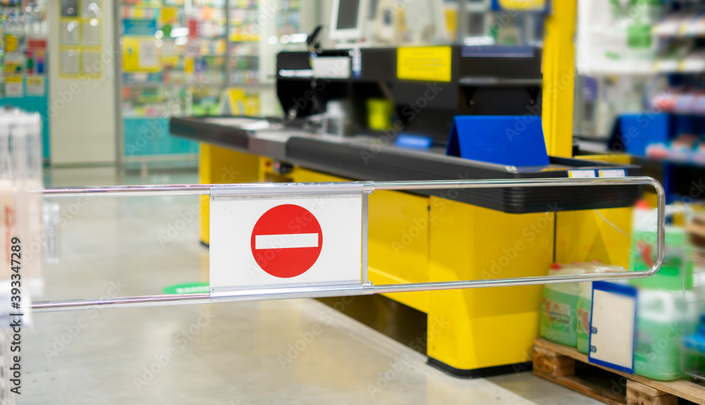closed barrier, stop sign in the food grocery store supermarket ...