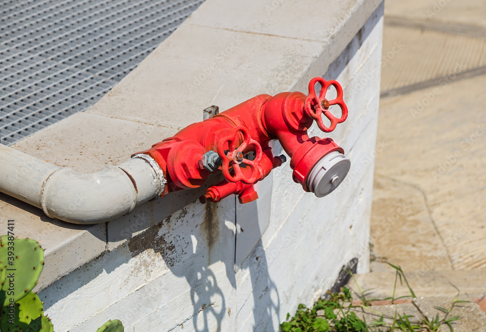 Old red fire hydrant in the street. Fire hidrant for emergency fire ...