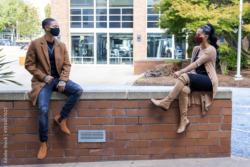 Two African American women wearing masks to protect from the Covid-19 ...