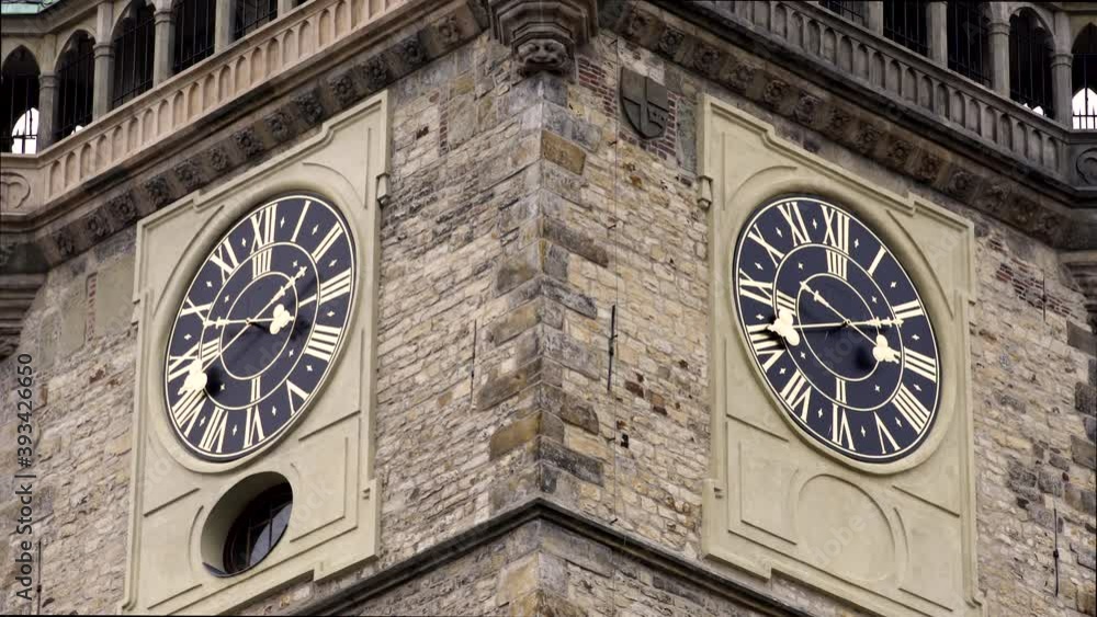 Time-lapse. One hour at Two sides of Clock on a tower of medieval ...