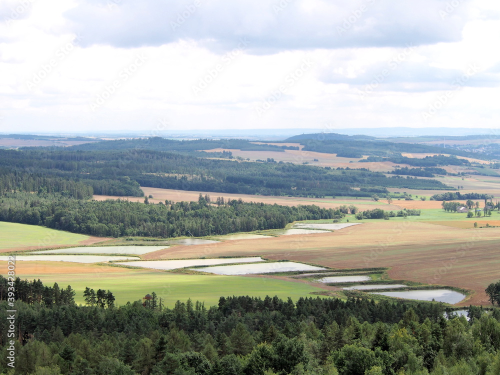 view of square water retention reservoirs in fields, cascades in ...