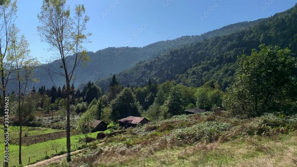 Footage of mountains, houses and trees captured in "Kulin" mountain of ...