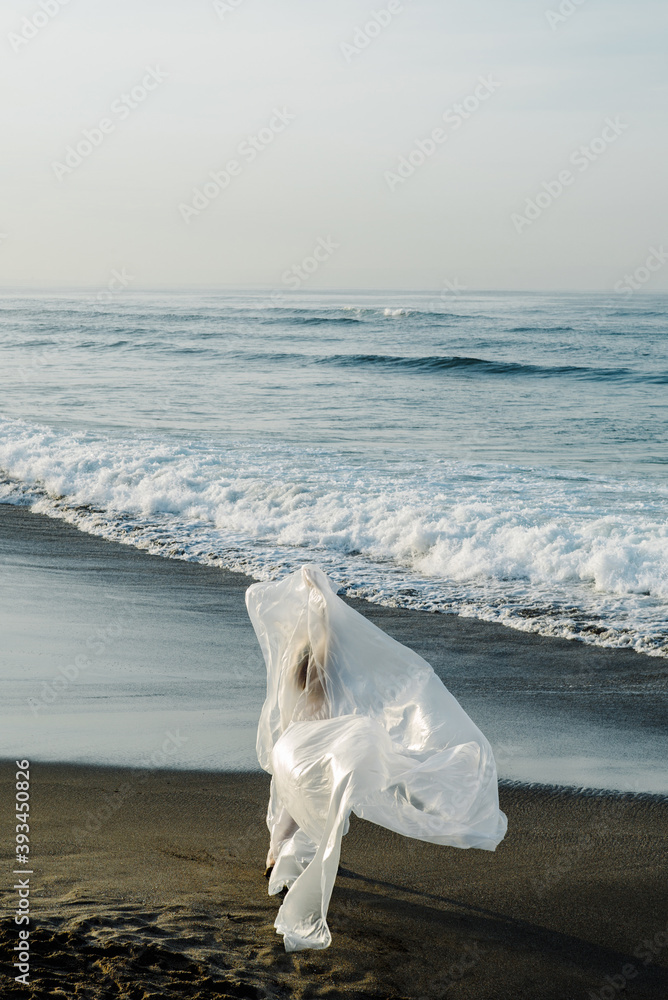 Concept plastic pollution. Pretty girl wrapped in plastic wrap. Stock ...