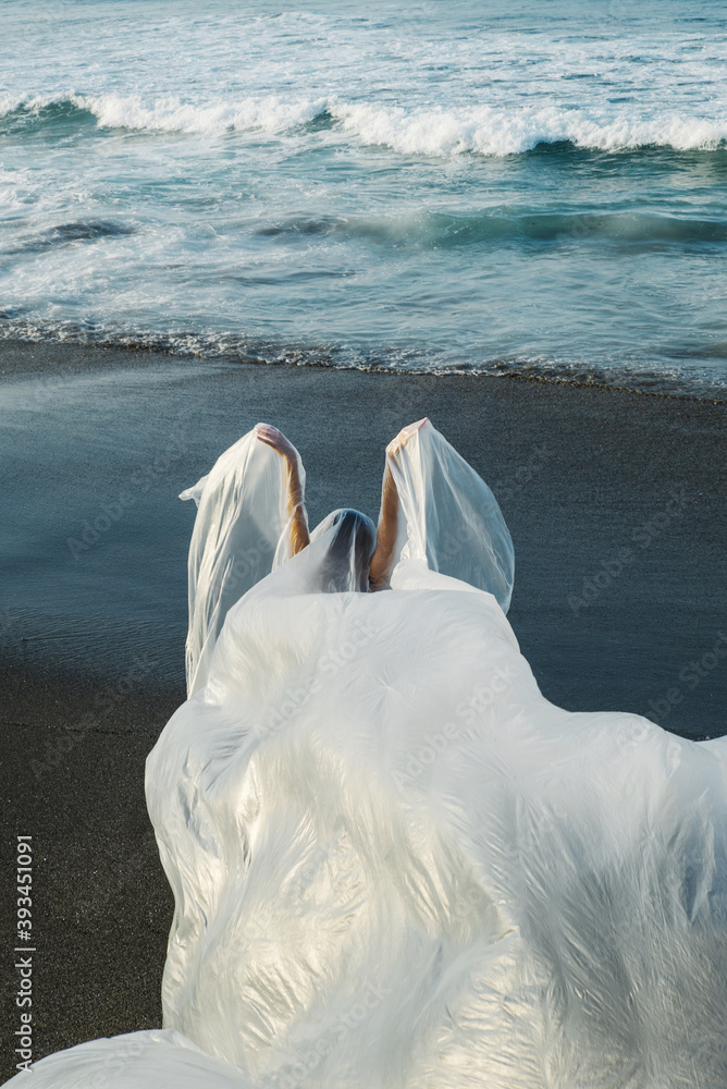 Concept plastic pollution. Pretty girl wrapped in plastic wrap. Stock ...