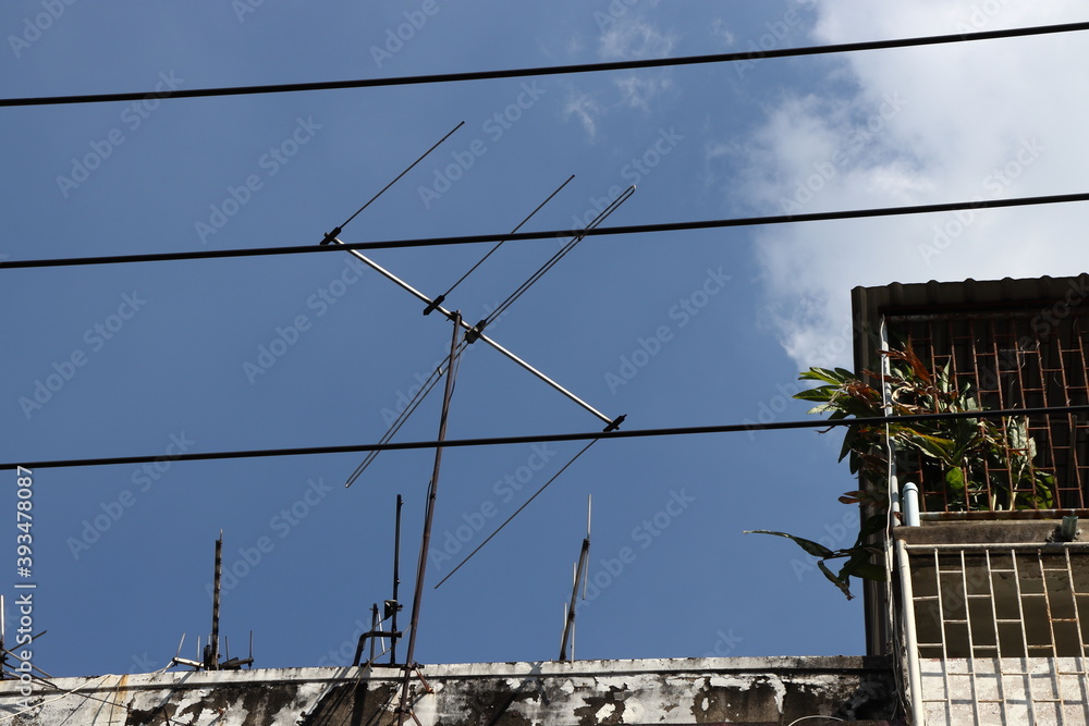 Old technology design of TV (Television) antenna installed at the top ...