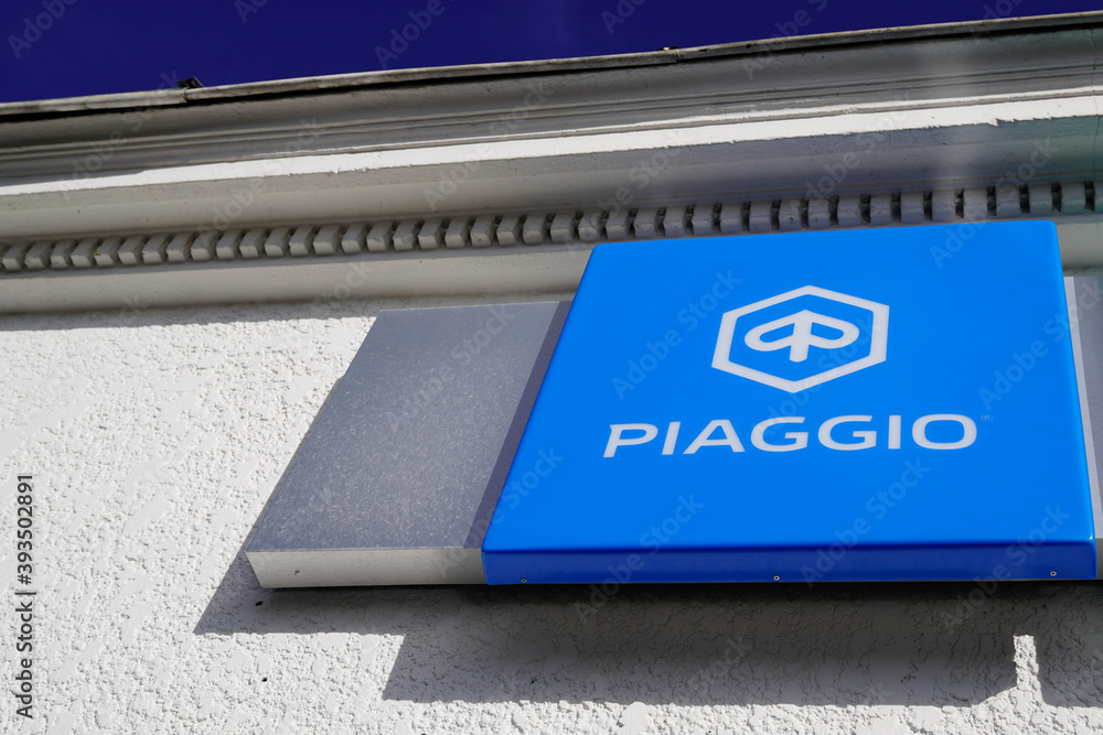 piaggio dealership logo and text sign on shop wall building of italian ...