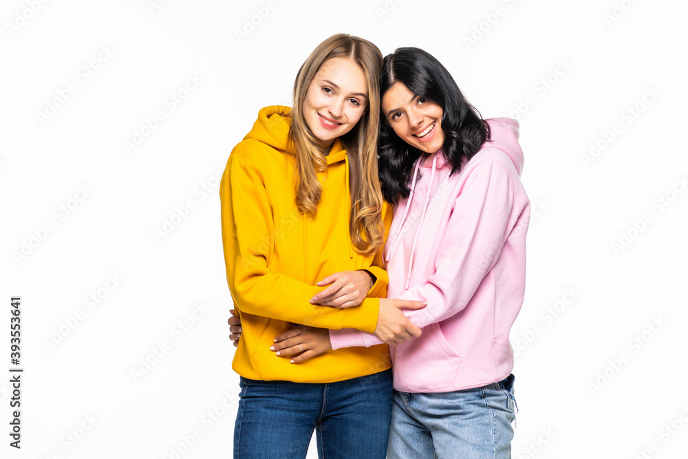Pretty two women wear casual hoodies and jeans isolated white ...
