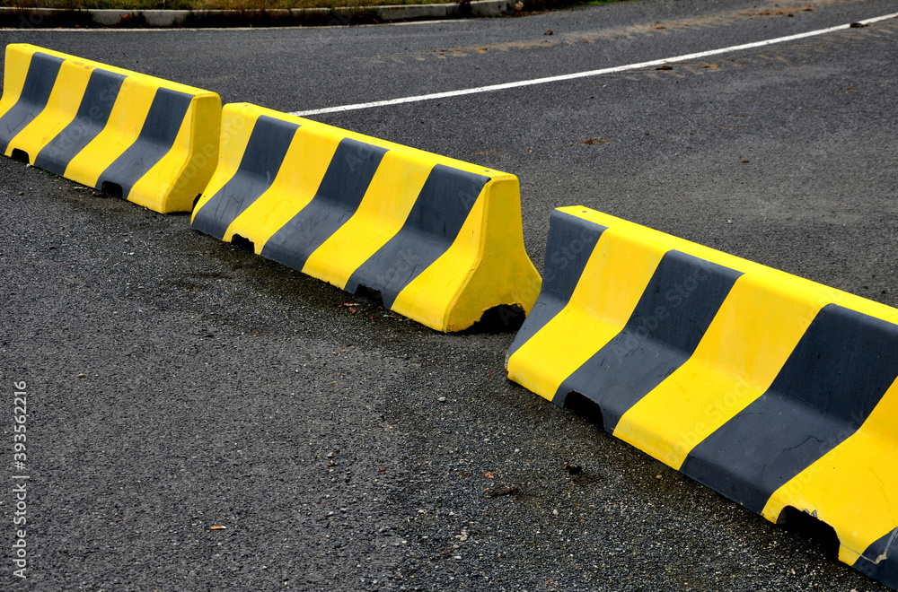 horizontal road marking lanes. highway concrete barriers on the road ...