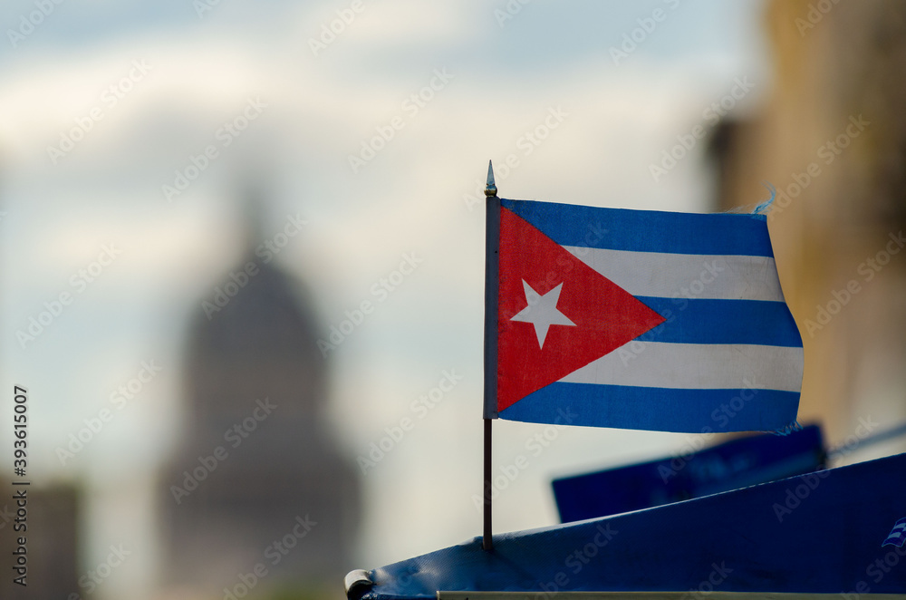 Cuban flag with the Cuban Capitol silhouette behind Stock Photo | Adobe ...