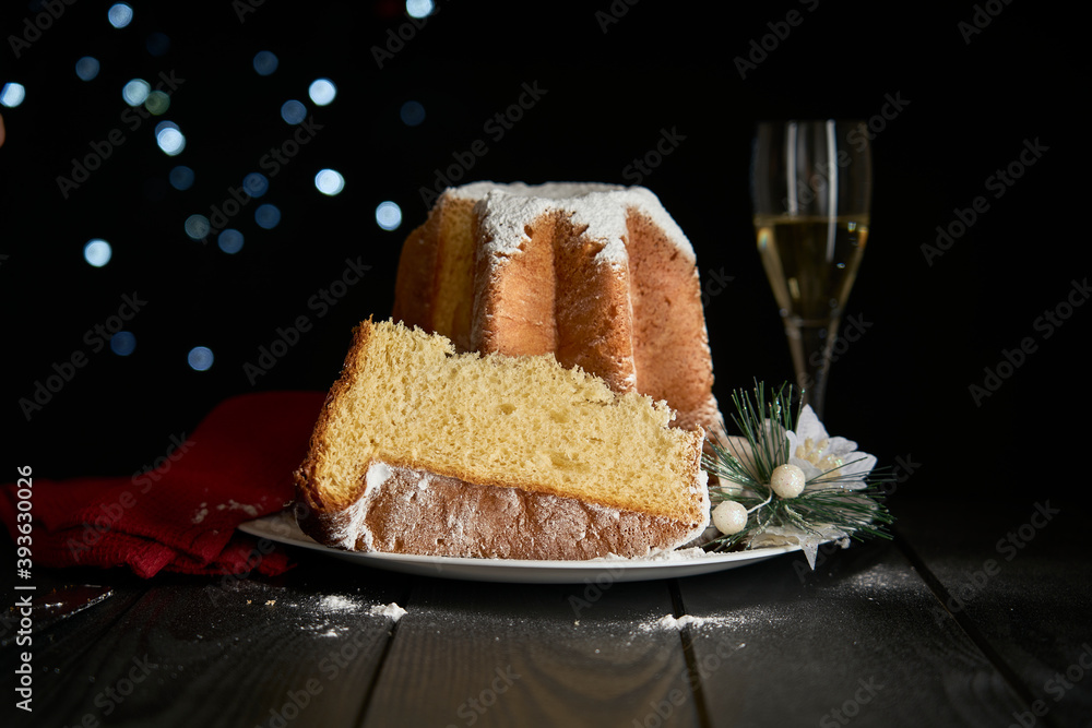 Cutting a slice of Pandoro, a typical Italian Christmas cake. The cake ...