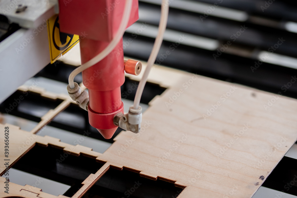Laser CNC cutting wood. Modern machine industrial technology Stock ...