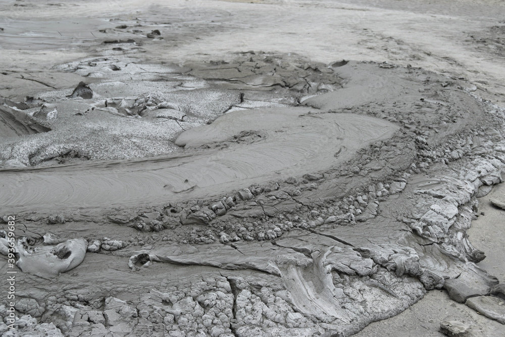 Mud liquid flowing from mud volcano, at Paclele Mari mud volcanoes in ...