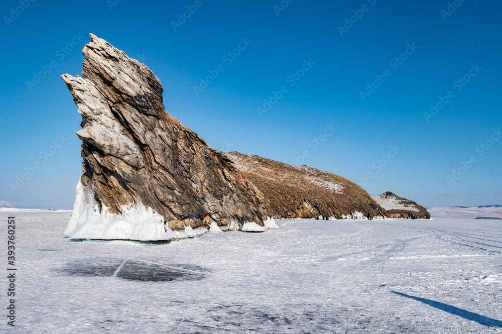 Spectacular landscape of the Dragon tail rock located at Ogoy island in frozen lake Baikal in ...