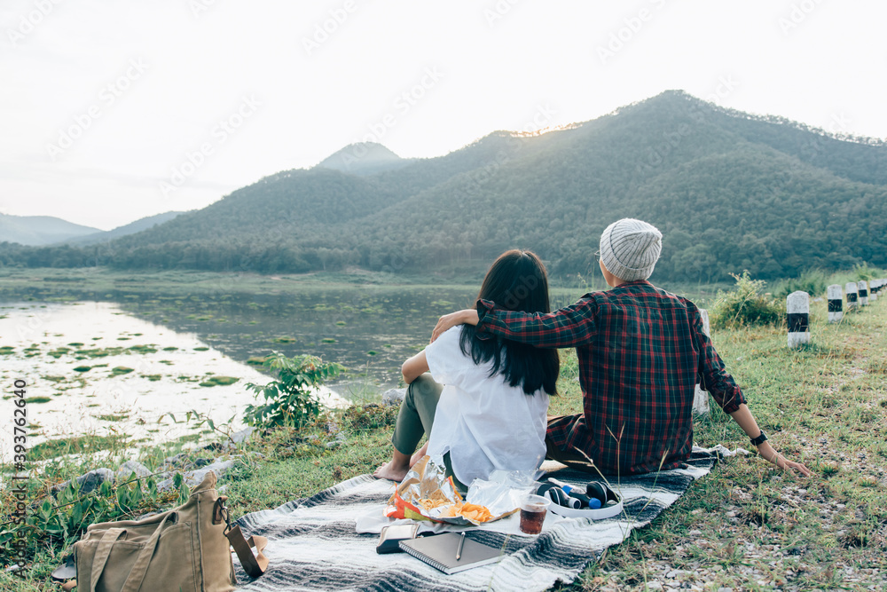 romantic friends looking view of sunset river, dinner together drinking ...