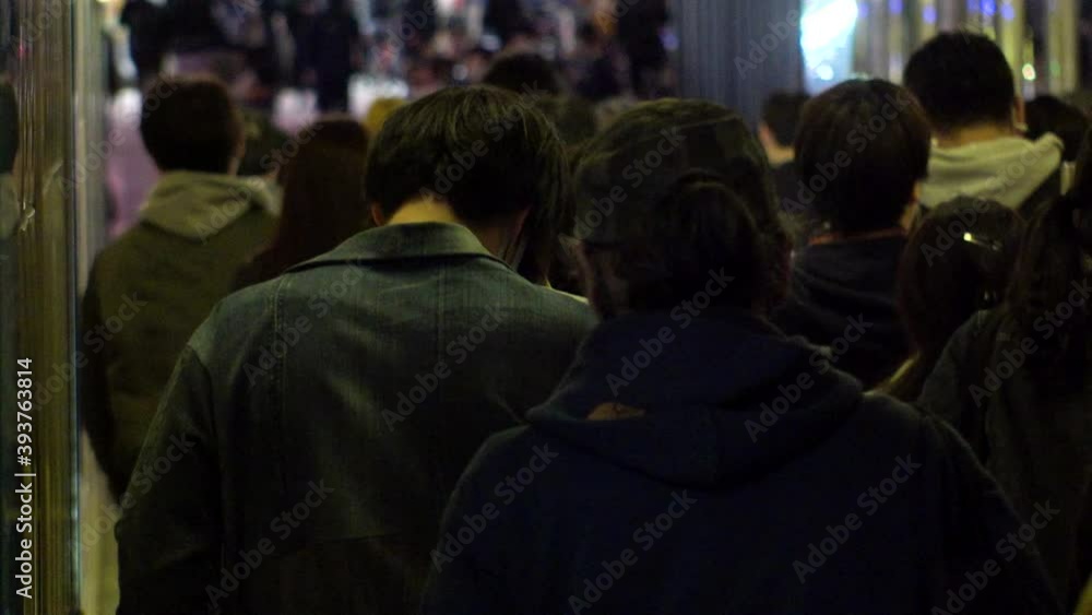 TOKYO, JAPAN : Crowd of people at the street in night time rush hour ...