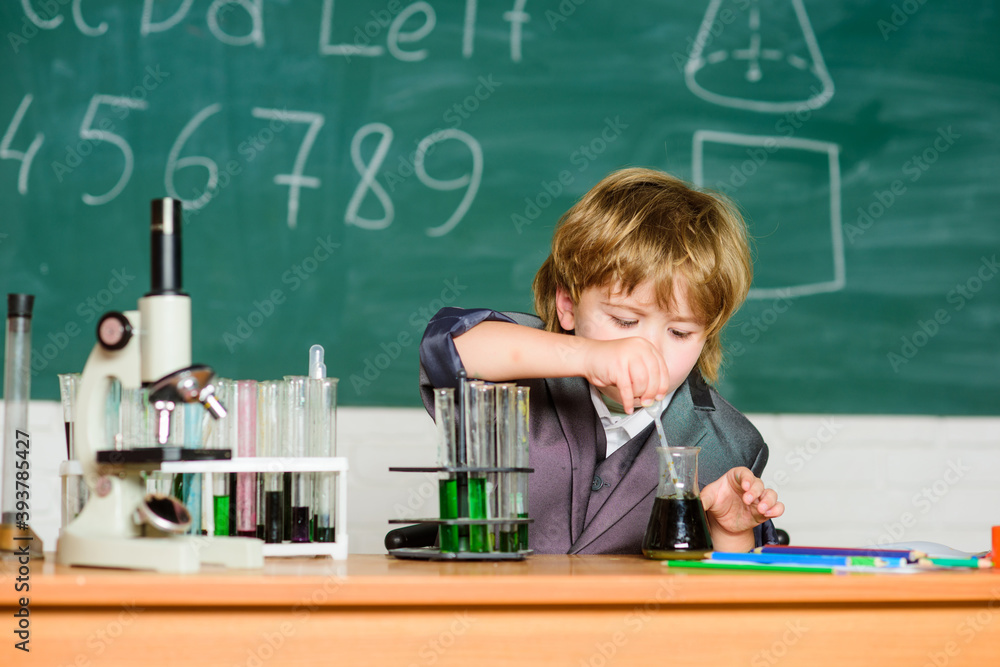 school kid scientist studying science. little boy at lesson. Back to ...