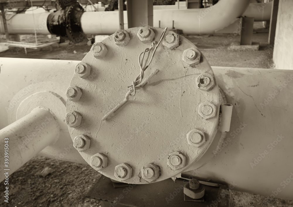 Multi-bolted manhole cover for gas pipeline inspection. Stock Photo ...