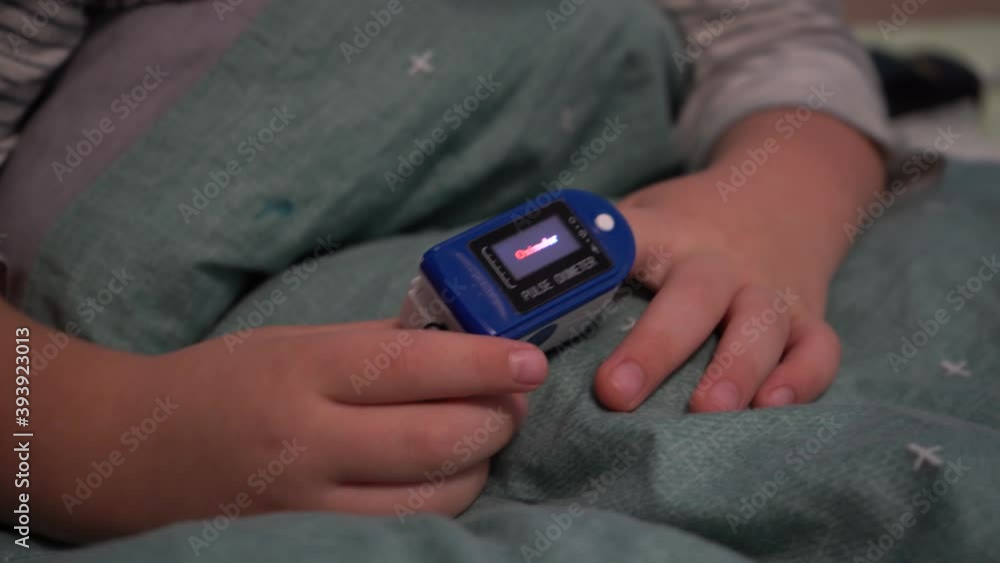 Europe, Kiev, Ukraine - November 2020: Children's hands measure oxygen ...