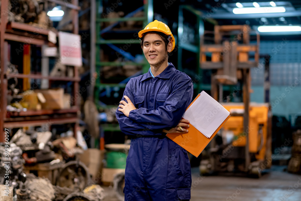 Portrait of Asian factory man or warehouse worker with smiling and ...