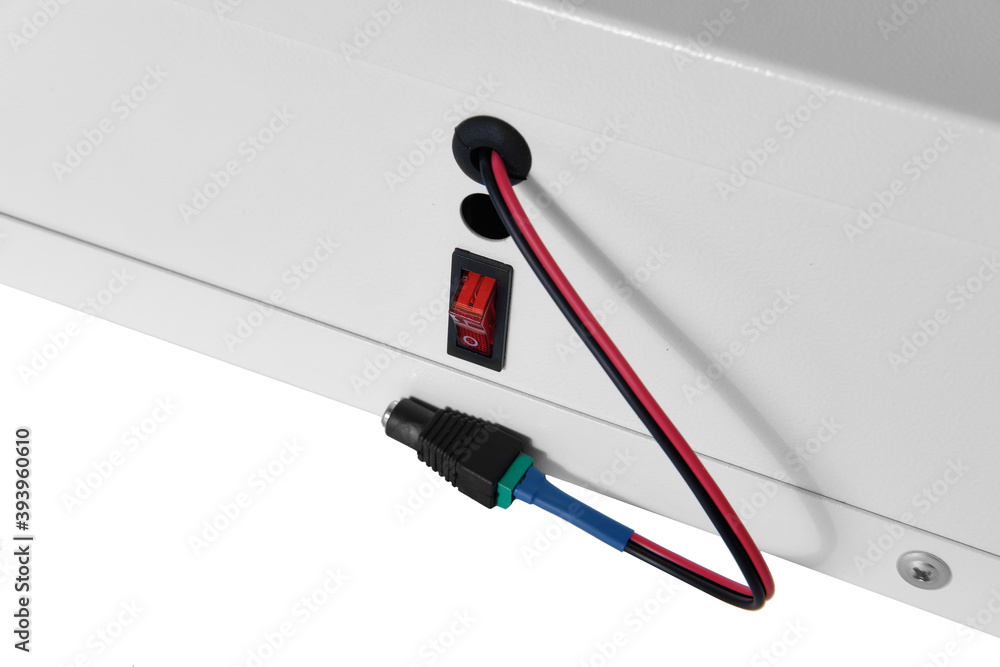 Red power switch in off position with power letter on. The wire is ...