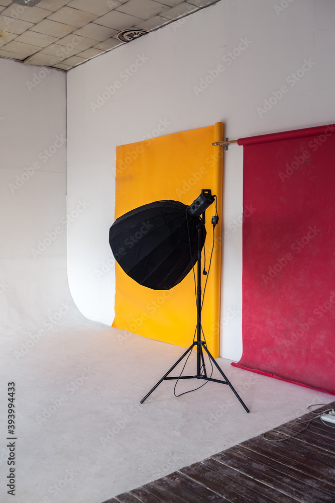 Large round softbox standing in the middle of the frame. Monochrome ...