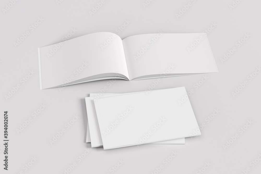 Stack of closed and open horizontal or landscape magazine or brochure ...