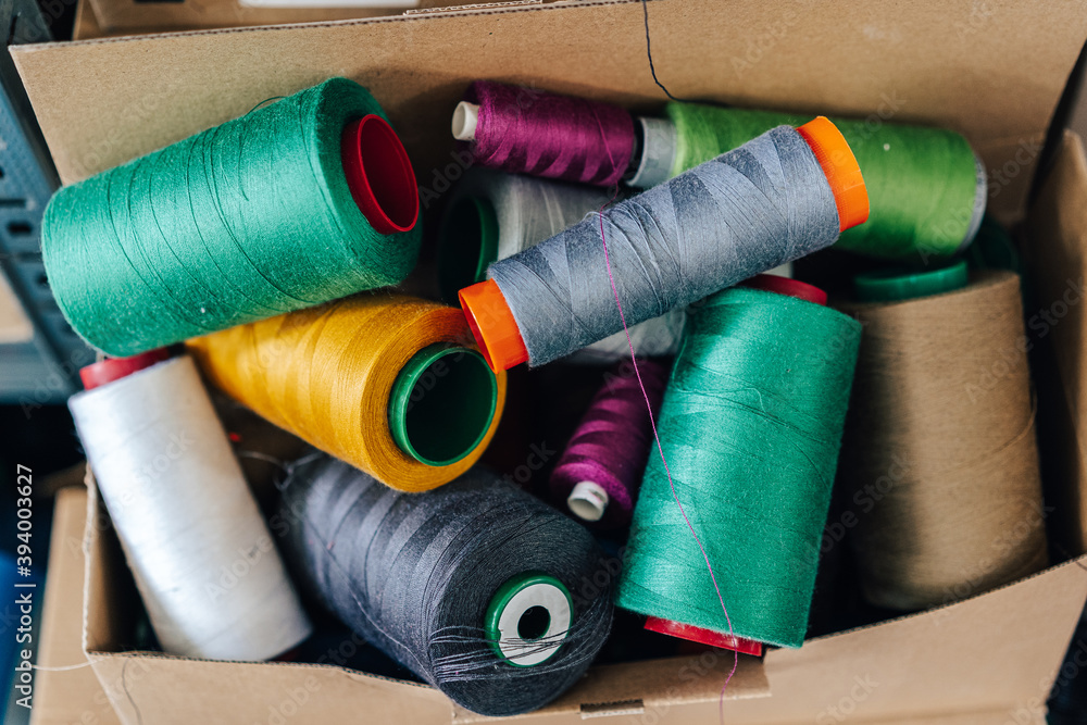 Detail close up photo of spools of threads. Spool of thread in ...