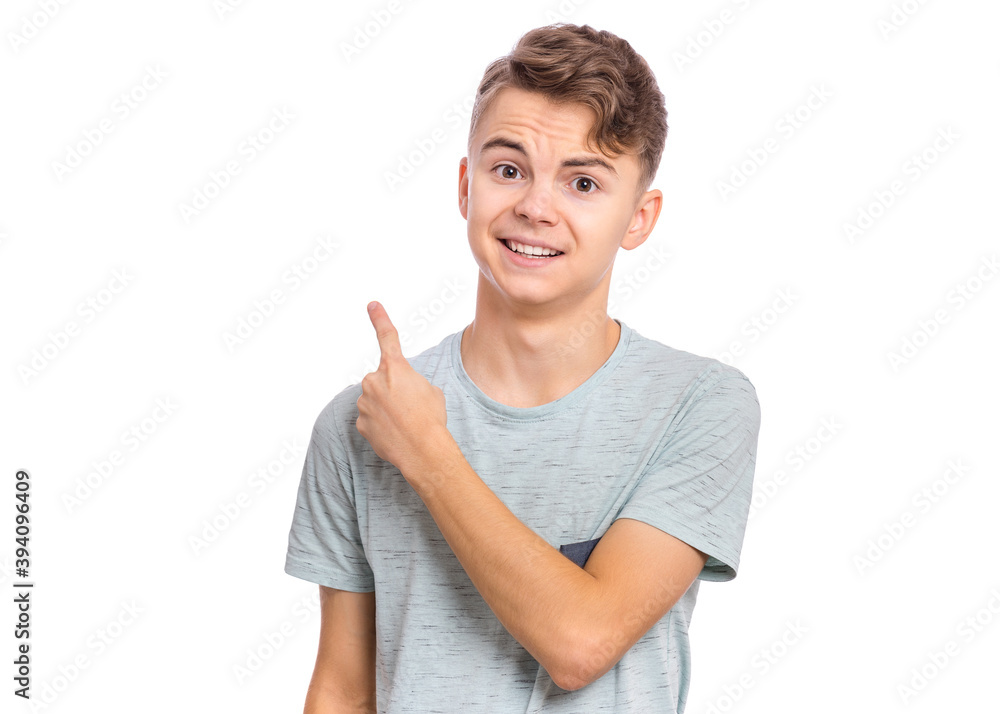 Cute teen boy pointing up, gesturing idea or doing number one gesture ...