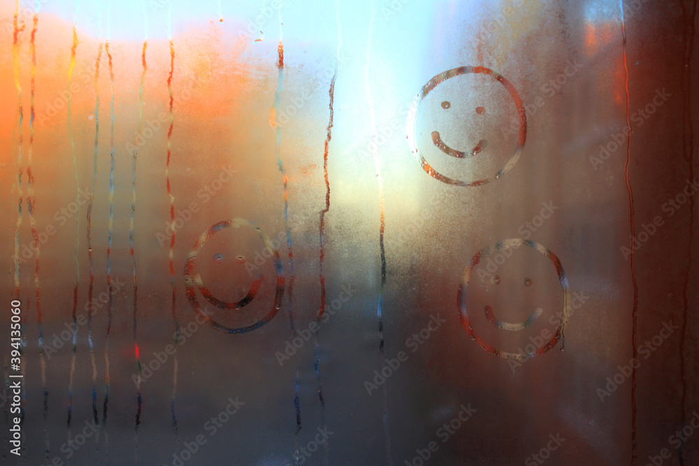 Children's drawing of a smile on the window. A smiling face painted on ...