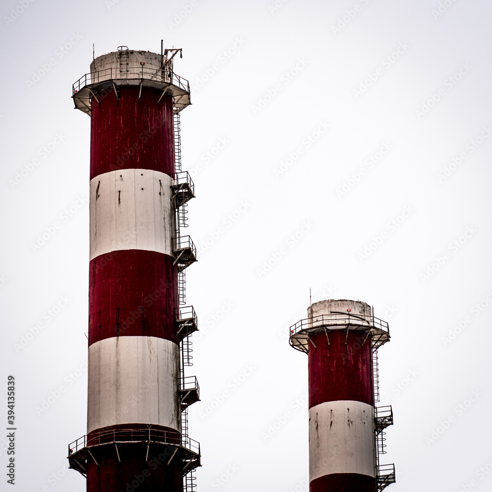 red and white Industrial chimneys. Commonly referred to as flue gas ...