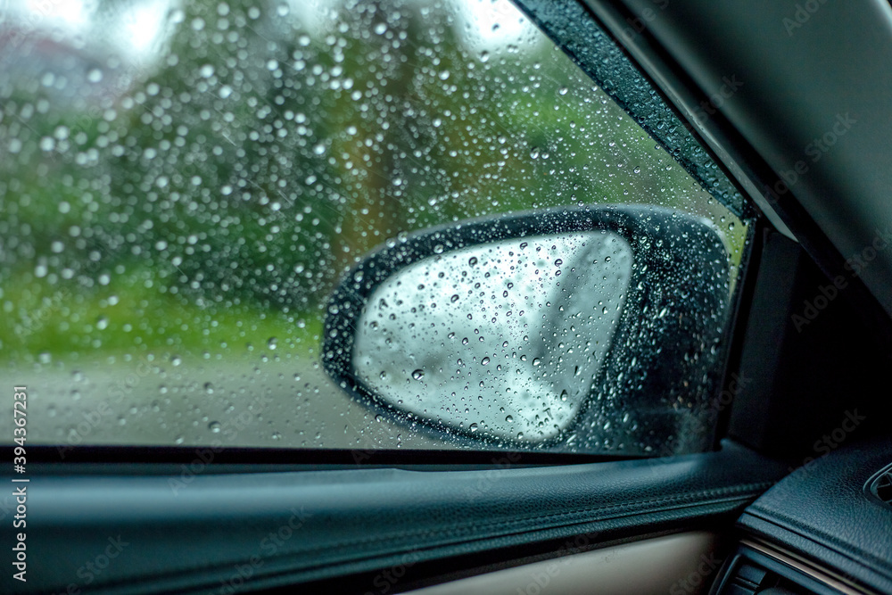 The background of rainwater drops on the glass, the waterless wallpaper ...