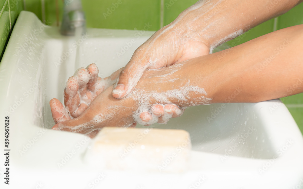 People washing hands with soap in sinks. Apply all over the arms and ...