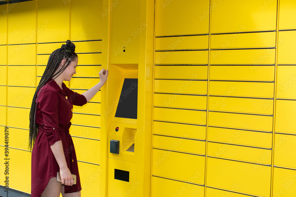 After entering the code, the teenager waits for the package to be ...