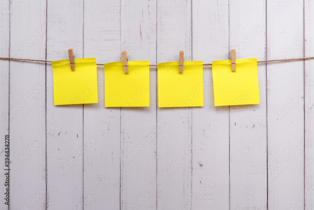 Four yellow paper note hanged with clothespin on a rope Stock Photo ...