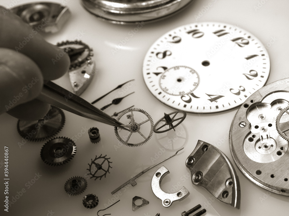 vintage watch under repair, display of parts of vintage watch mechanism ...