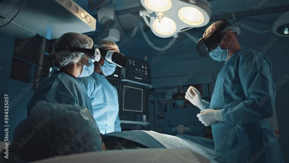 Multi-race professional group of surgeon, nurses and interns using ...