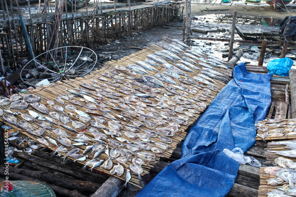 Drying fish in the sun at the Tanjung Pandan fish market in Belitung ...