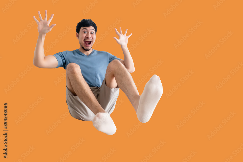 Funny full body of shocked Asian man being blown away on isolated ...