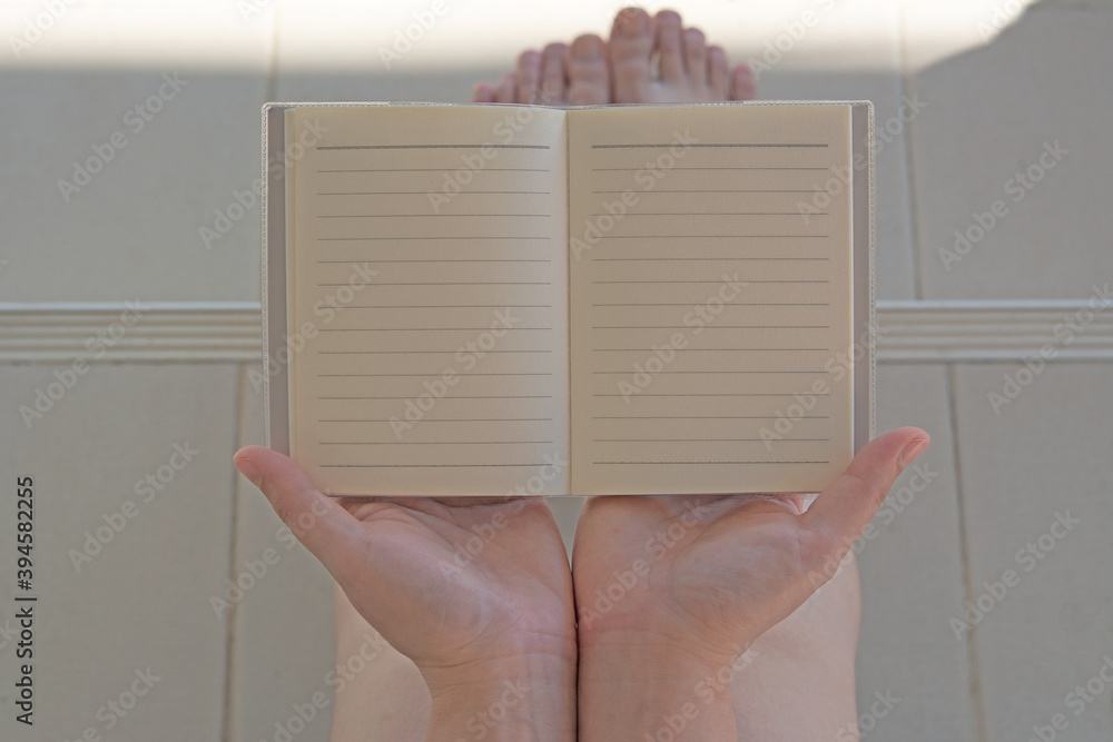 women hand holding open book ,Mock up template for adding your content ...