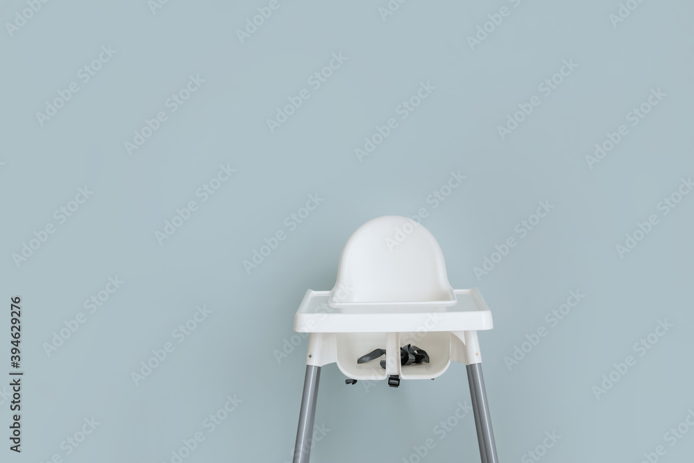 Baby highchair on color background Stock Photo | Adobe Stock