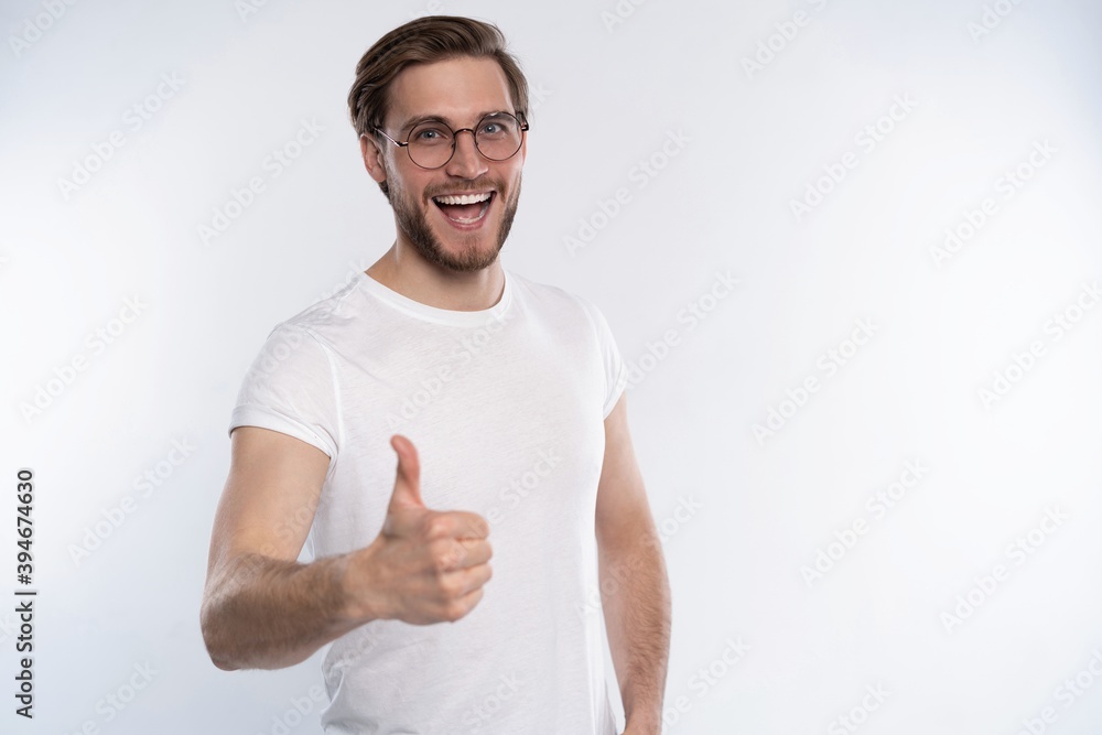 Happy man giving thumbs up sign isolated on white background. Stock ...