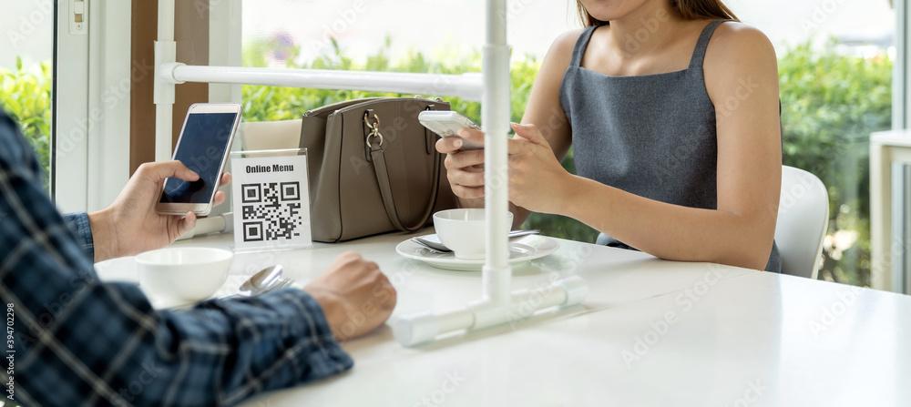 Foto de Asian customer scanning QR code for online menu in new normal ...